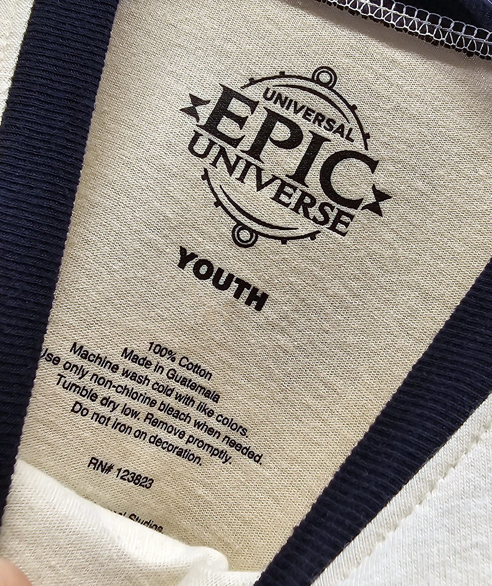 Universal Studios Epic Universe Logo Ivory Epic Emblem Youth Ringer T ...